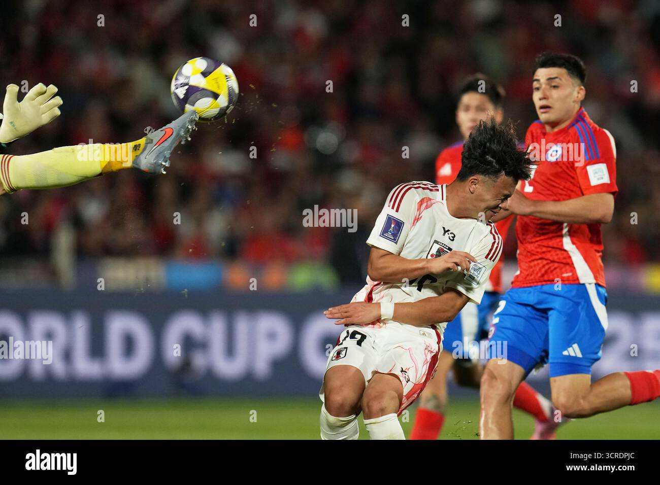 Japan's Rento Takaoka, center, reacts as Chile's goalkeeper Sebastian ...