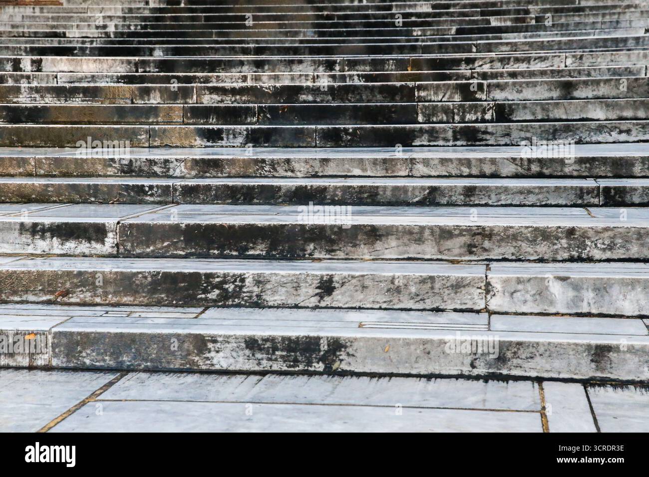 Worn marble steps of an ancient structure in Athens, Greece, showing ...