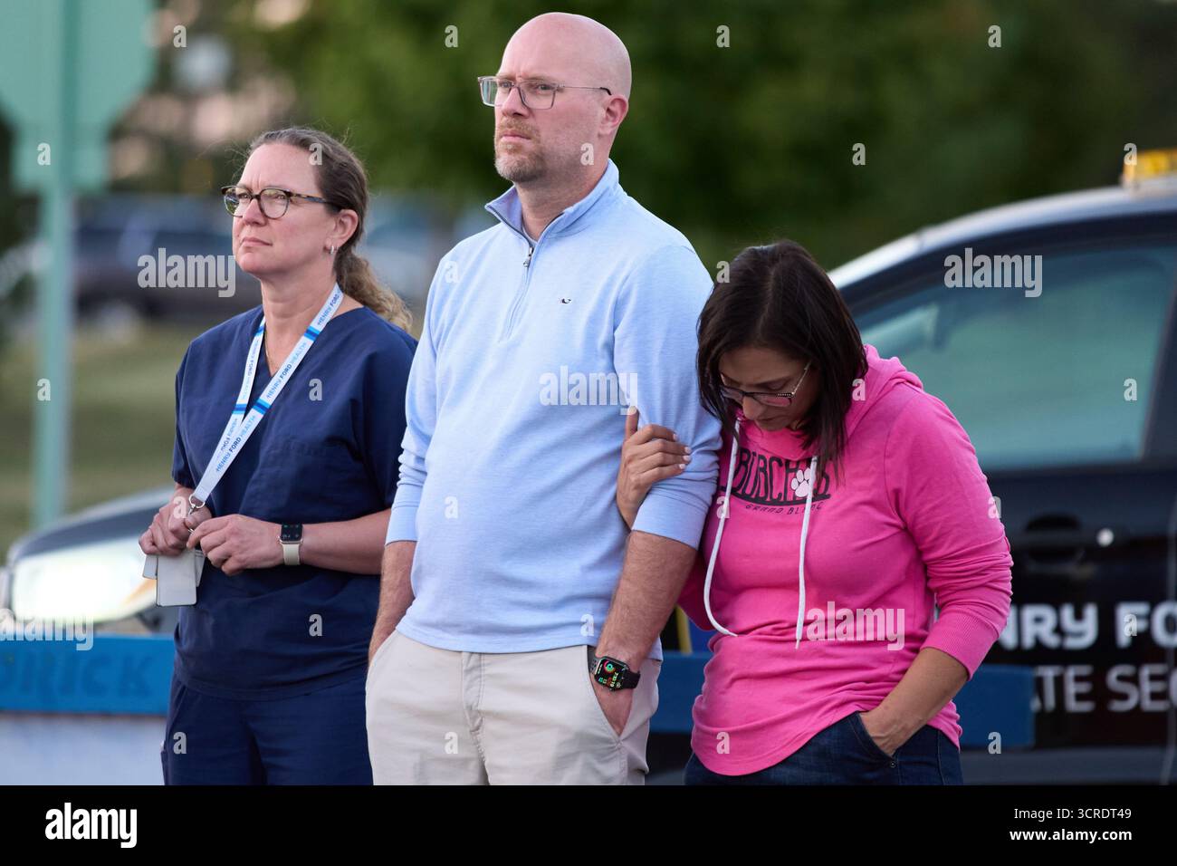 Mourners gather during a vigil held at the Henry Ford Genesys Regional ...