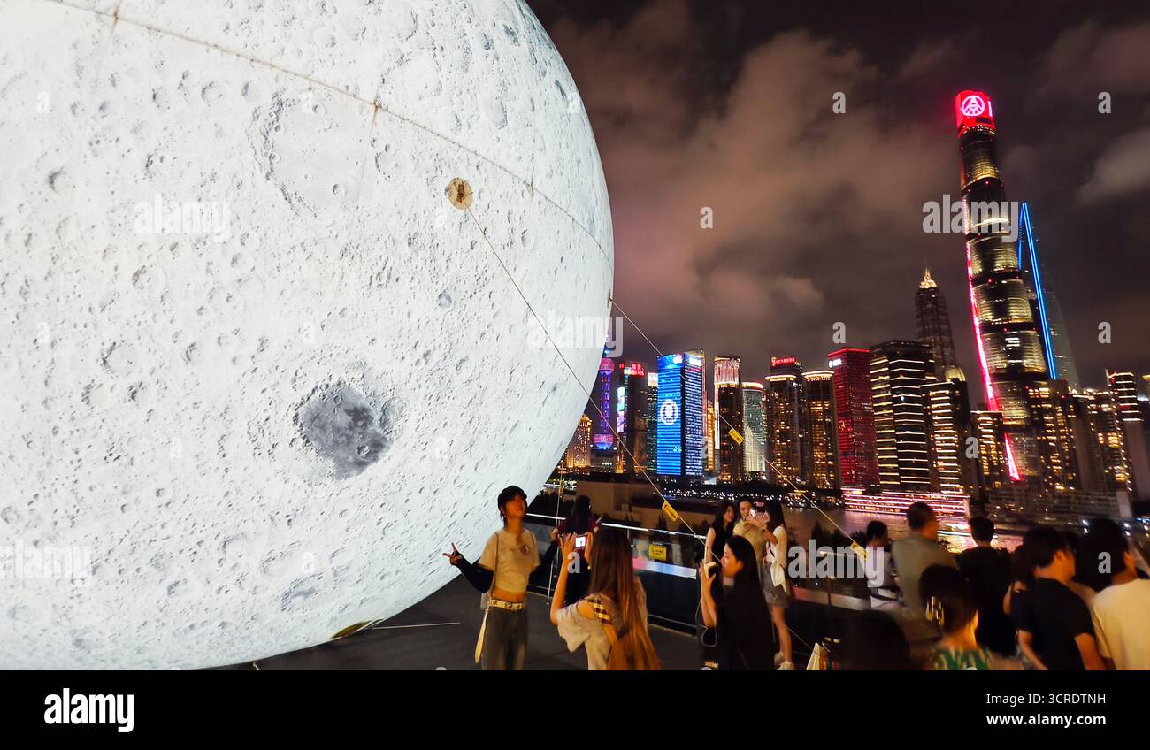 Shanghai, China. 28th Sep, 2025. Tourists visit the Super Moon Art ...