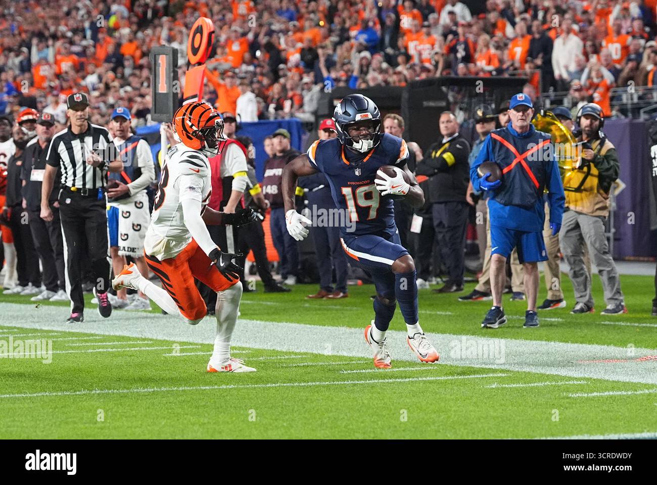 Denver Broncos wide receiver Marvin Mims Jr. (19) runs for a touchdown past Cincinnati Bengals ...