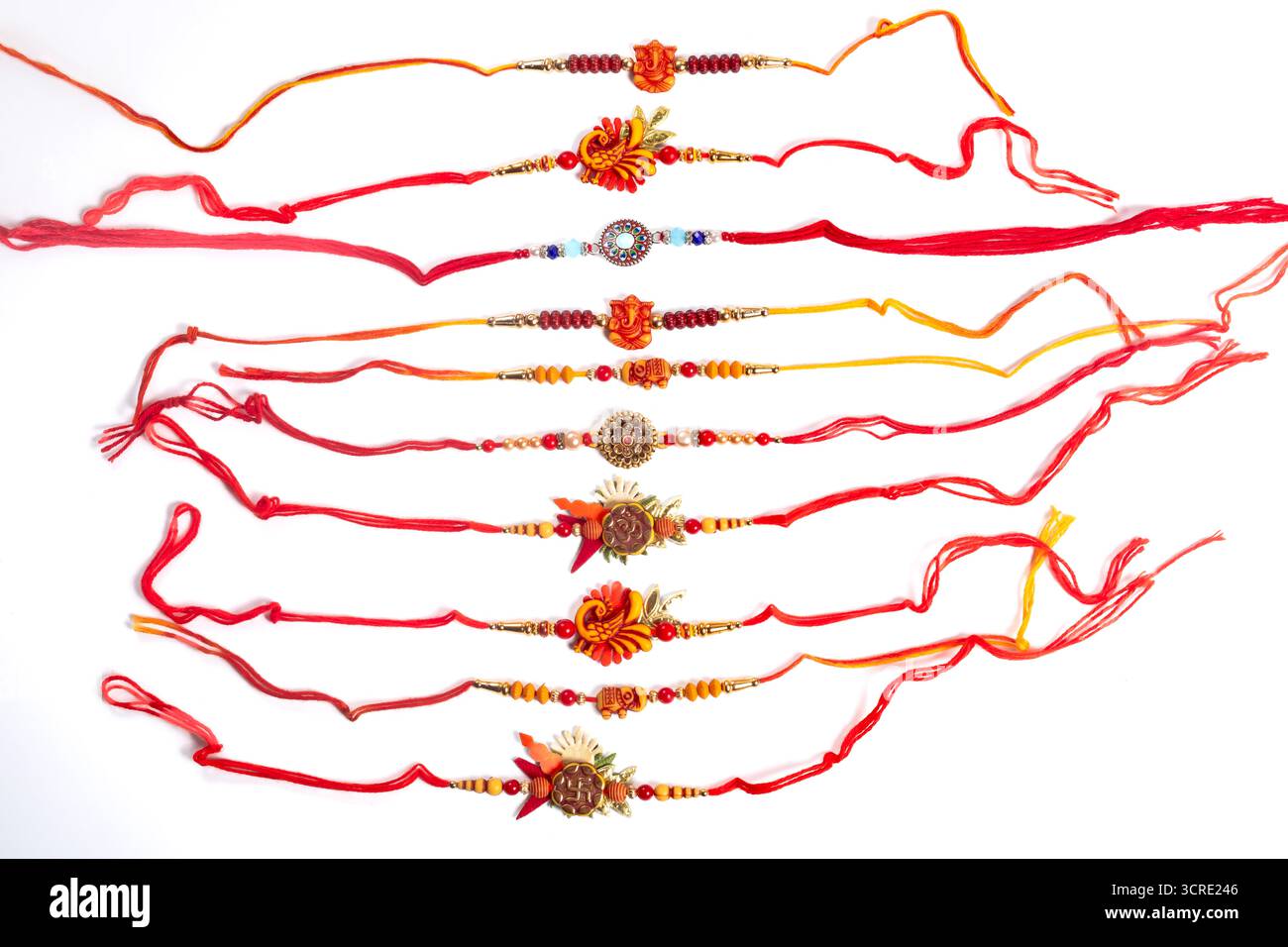 A collection of vibrant rakhis set on a white background, symbolizing ...
