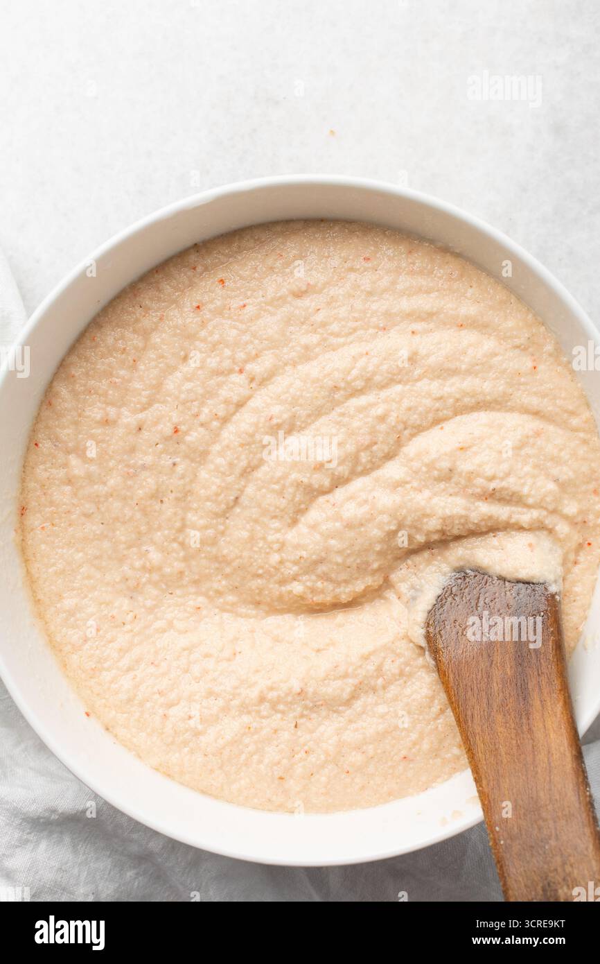 Overhead of moi moi mixture in a white ceramic bowl, top view of ...