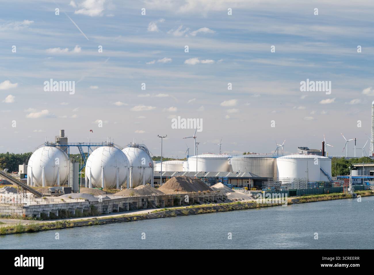 White storage tanks and silos at Snepvoeders animal feed plant along ...