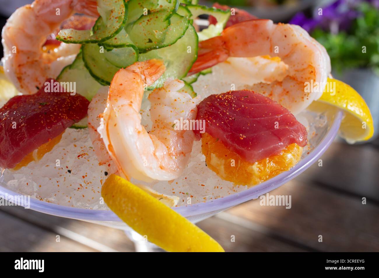 A closeup view of a seafood tower, featuring ahi and shrimp Stock Photo ...