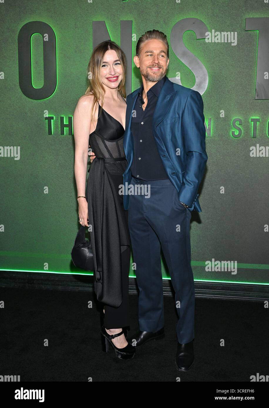 Charlie Hunnam, right, and Morgana McNelis attend the world premiere of Netflix's "Monster: The ...