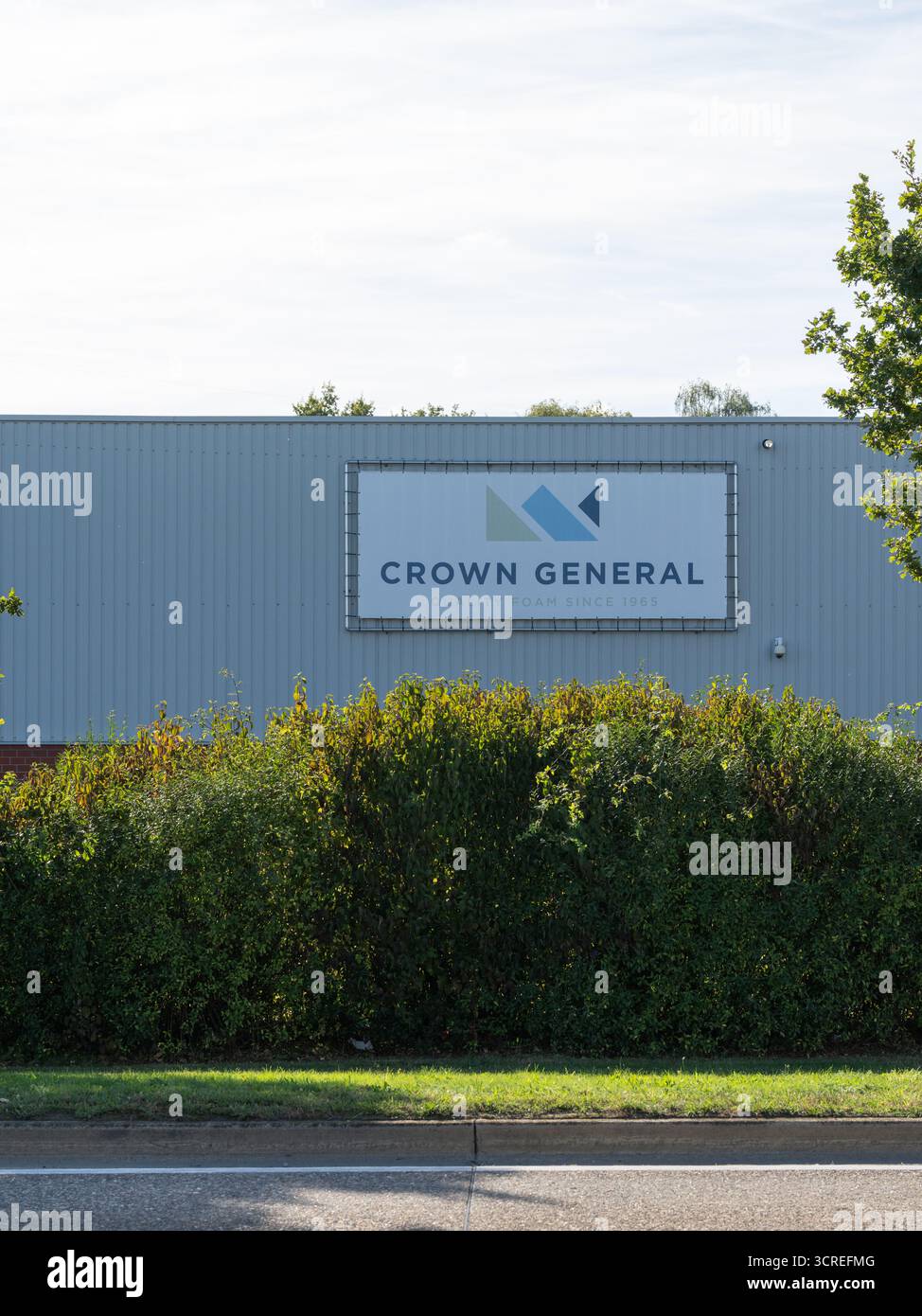 Industrial warehouse of Crown General with company logo on the facade ...
