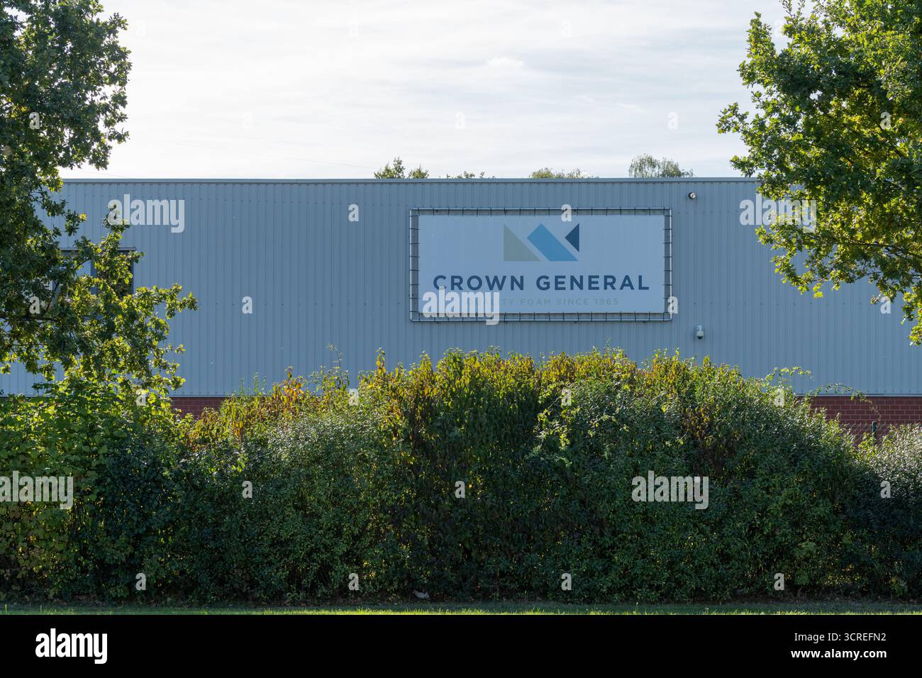 Industrial warehouse of Crown General with company logo on the facade ...