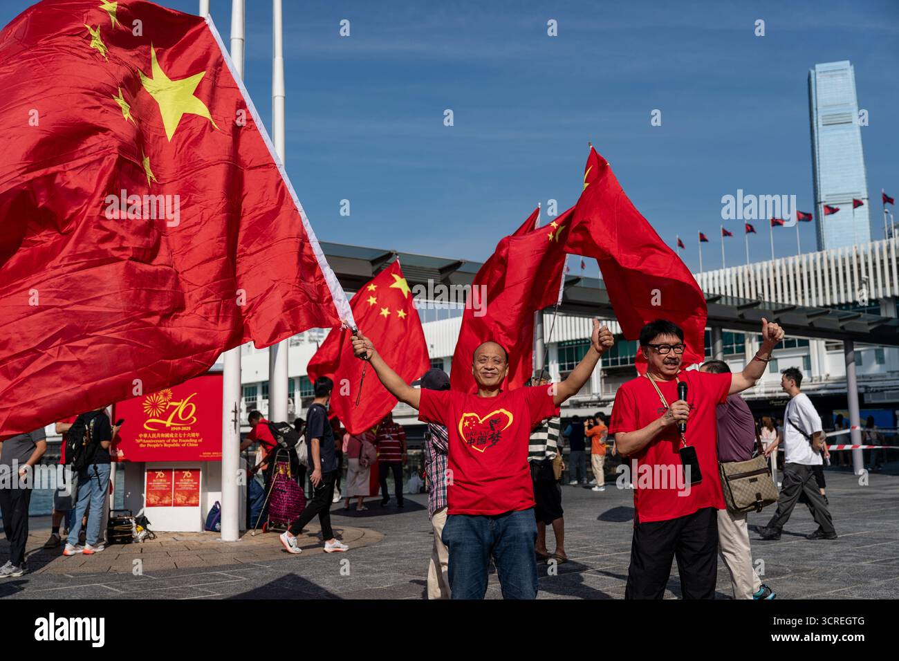 Pro-Beijing supporters waving the national flag of china in Tsim Sha ...
