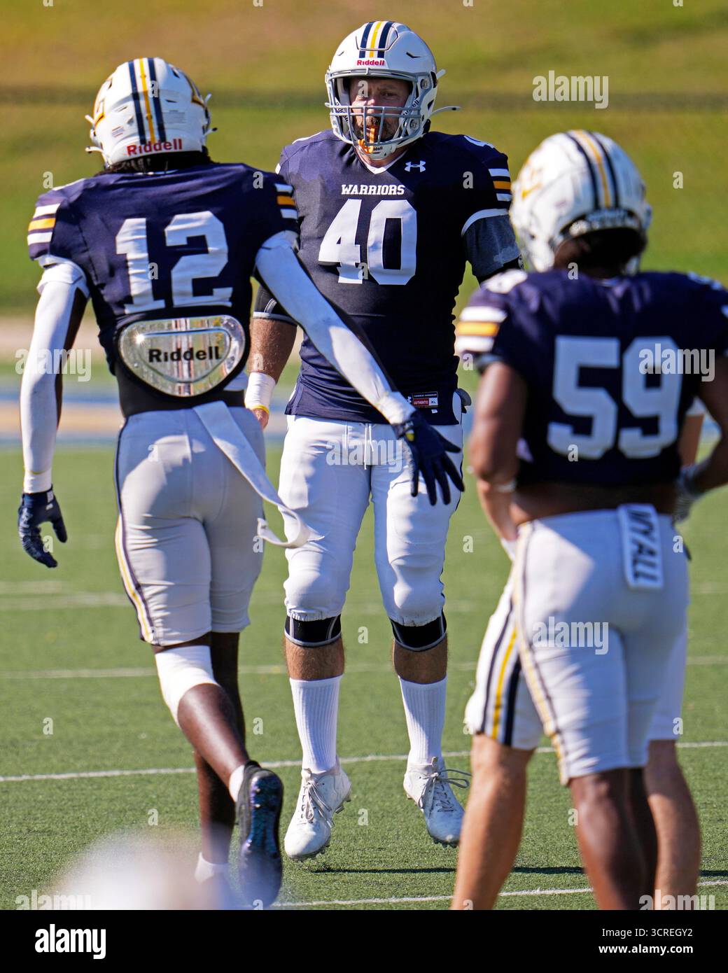 Teammates celebrate with Lycoming College nose tackle Tom Cillo (40) as ...