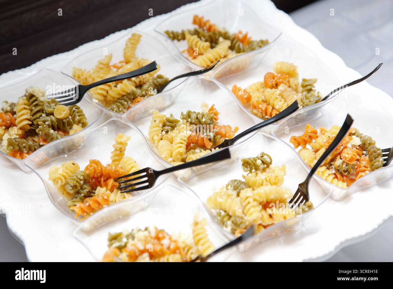 A view of a catered platter of pasta salad Stock Photo - Alamy