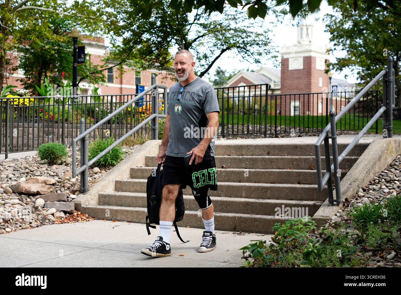 Lycoming College freshman Tom Cillo walks across campus, toting a 40 ...