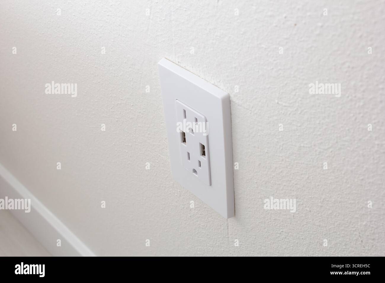 A view of a modern design electrical plug socket in a home setting ...