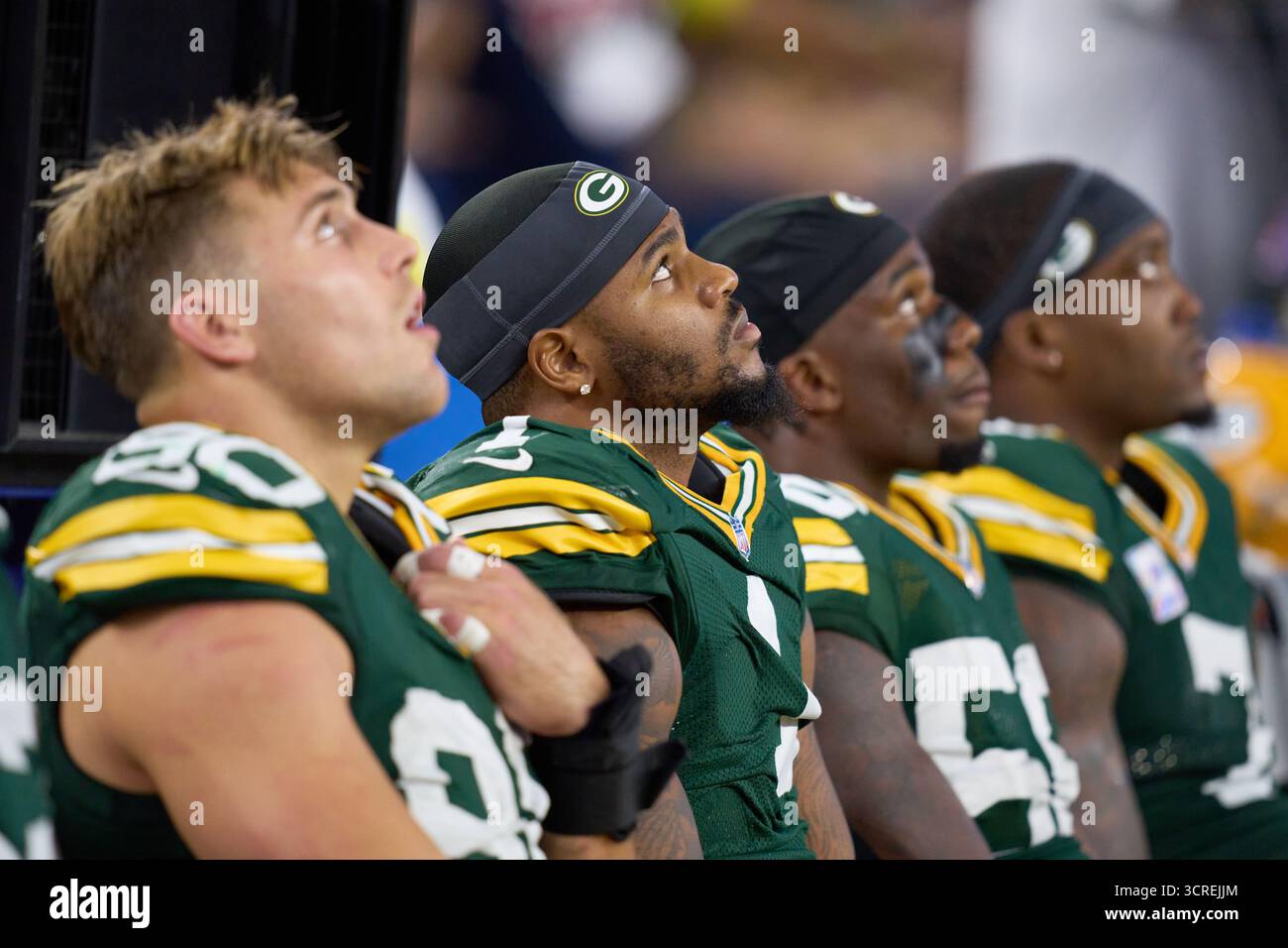 Green Bay Packers defensive end Micah Parsons (1) sits with teammats ...