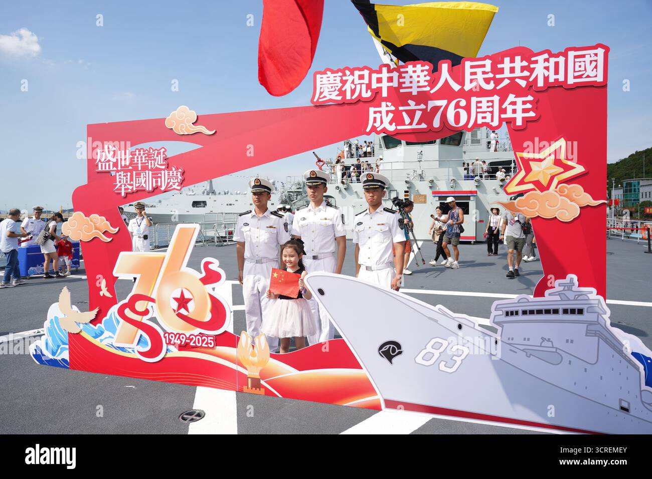 A girl posing for photos with PLA officers on the deck of the Chinese ...