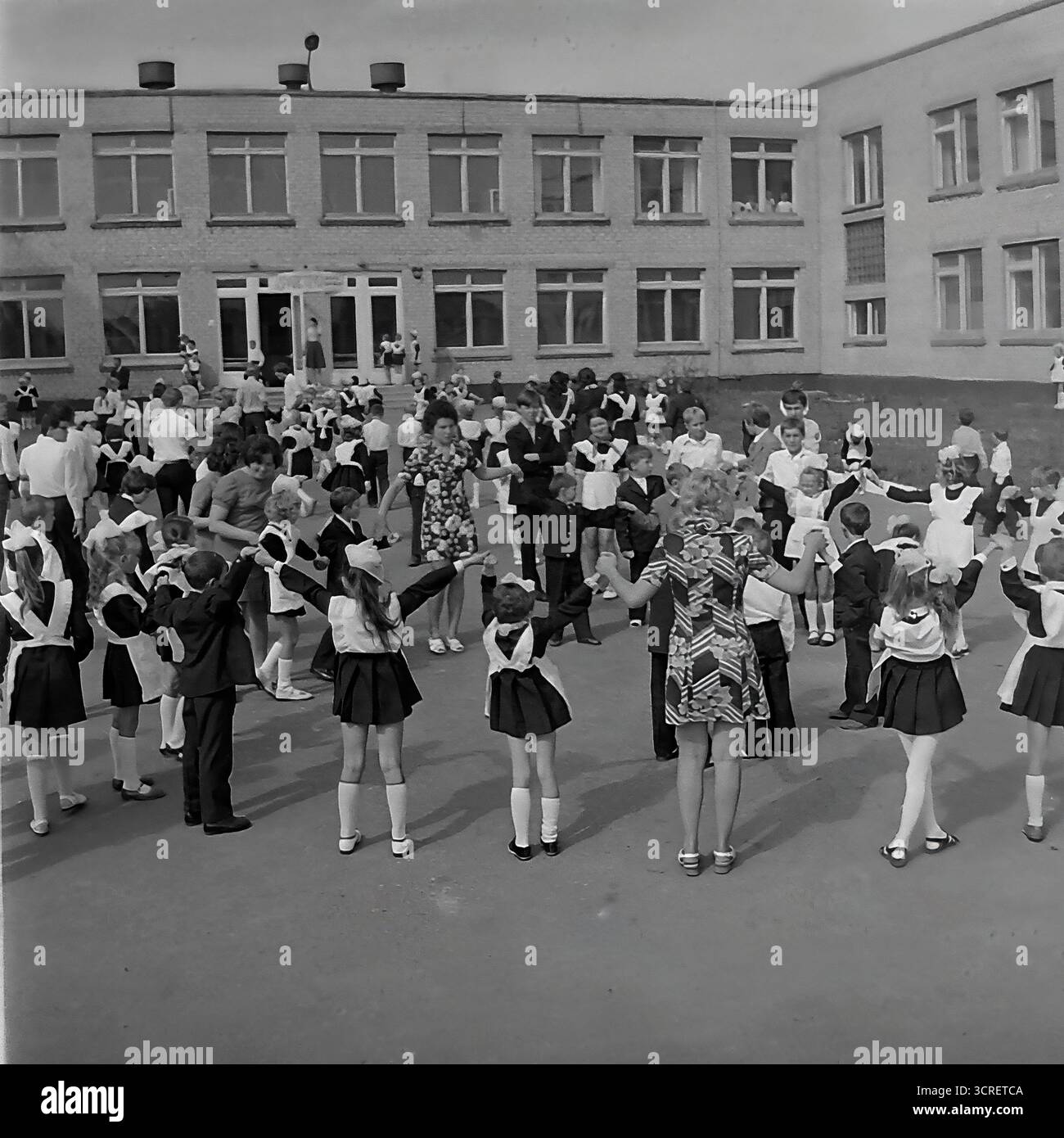 An authentic black and white photograph from the 1980s capturing a ...