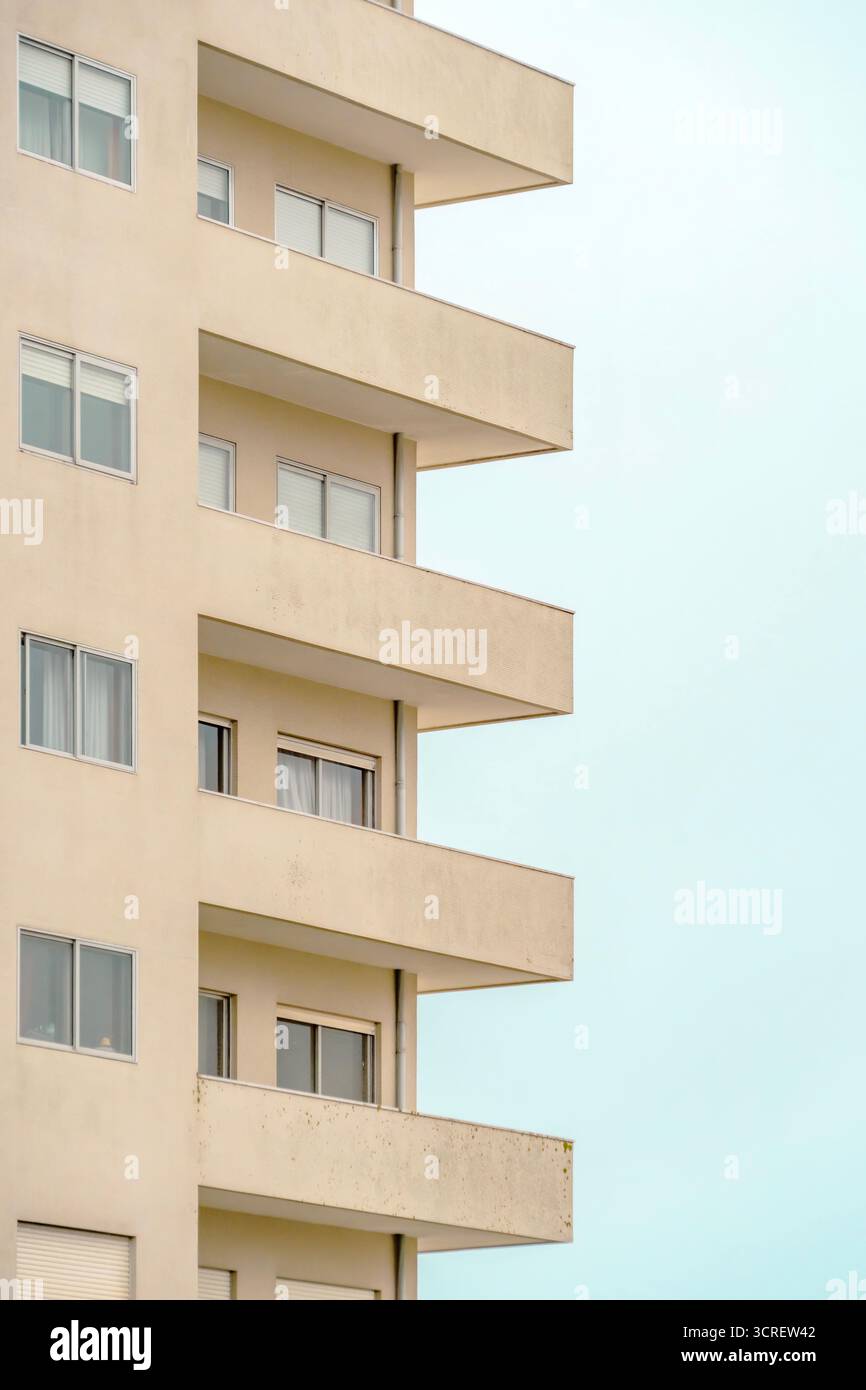 Minimalist facade of a typical modern apartment building with repeating ...