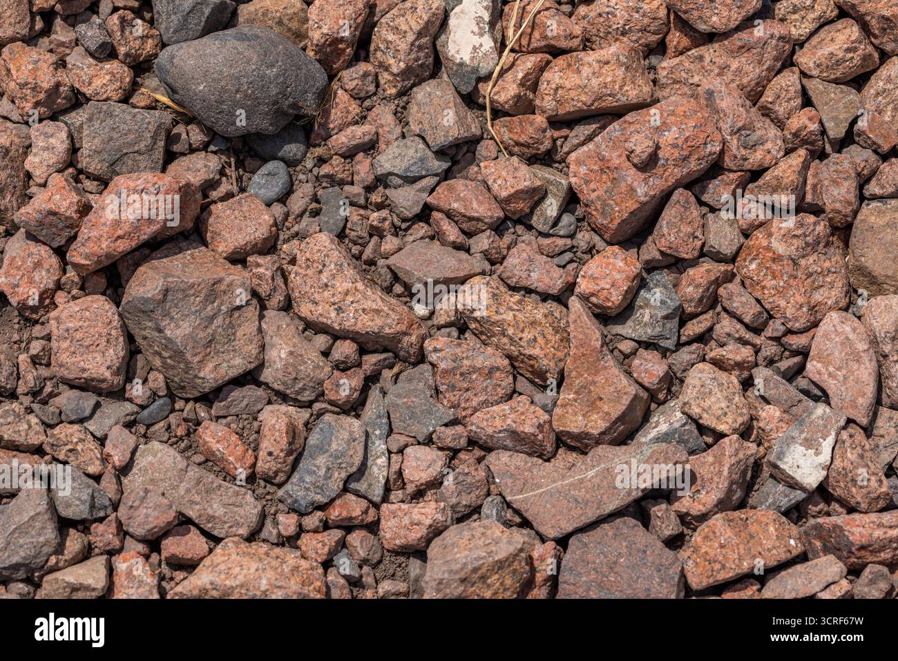 Red crushed granite rocks hi-res stock photography and images - Alamy