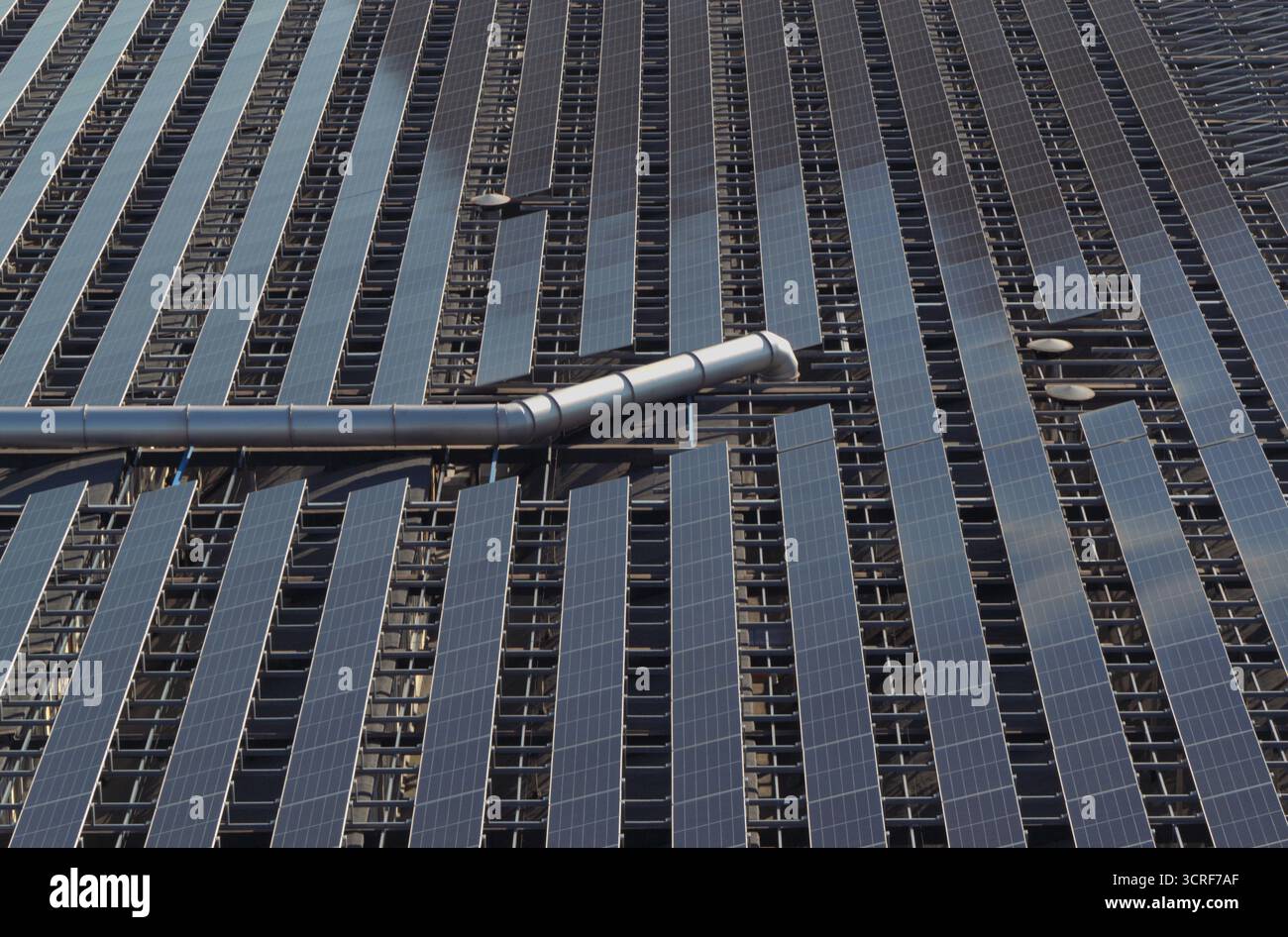 Industrial roof covered in solar panels, solar farm, renewable energy ...