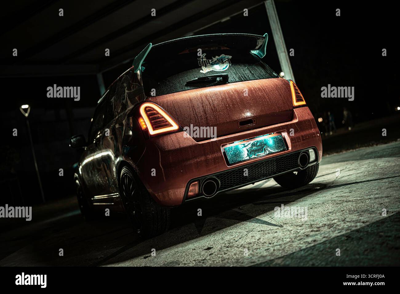 Rome, italy 30 september 2025: modified red hatchback car with a ...