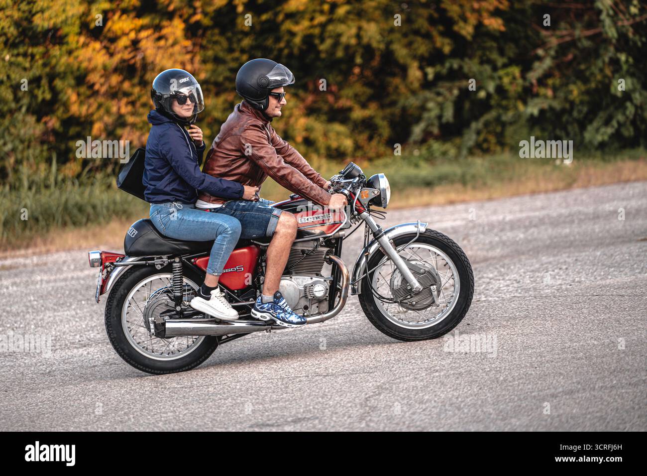 Padova, italy 1 october 2025: couple on a vintage benelli motorcycle ...
