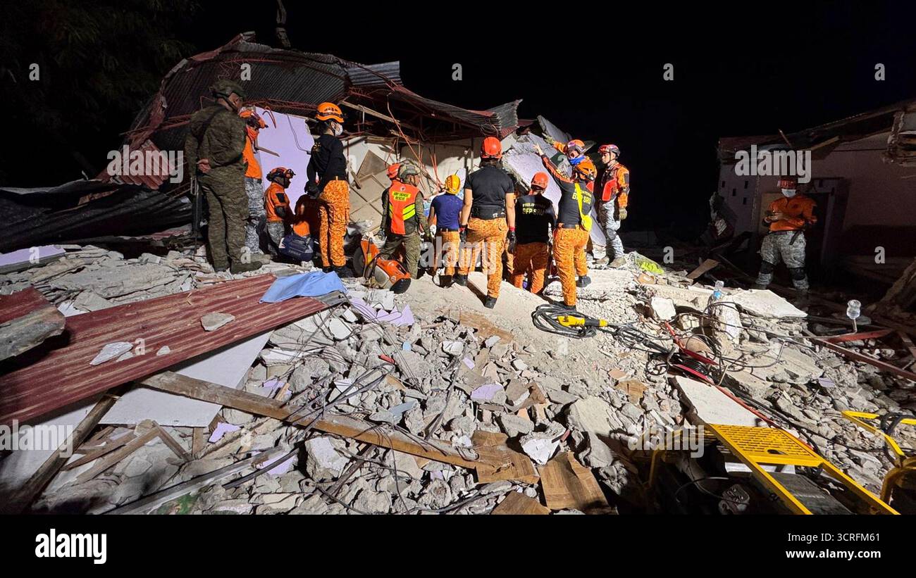Rescuers search for survivors underneath rubble in Bogo city ...