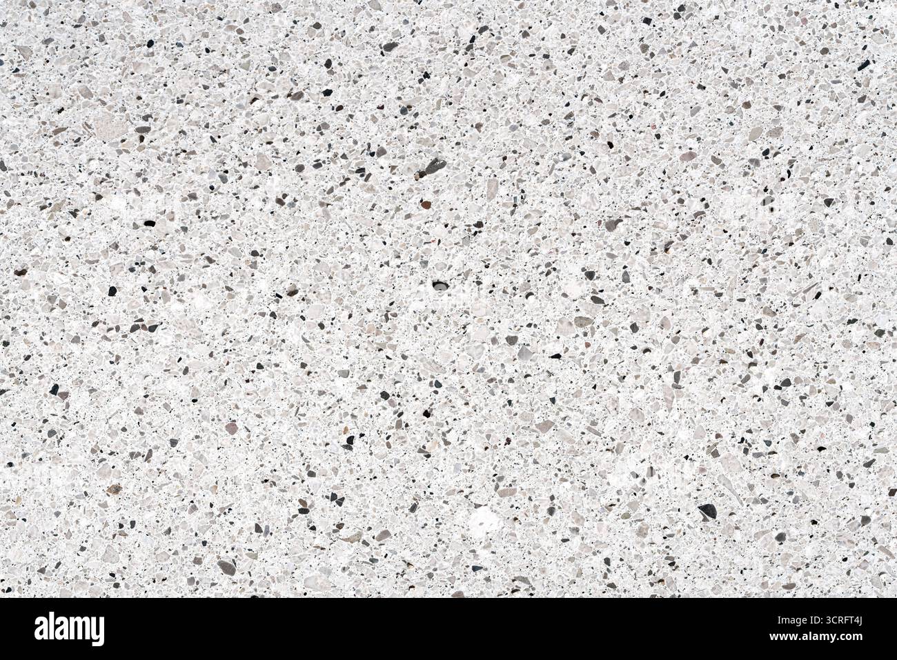 Close-up texture of white quartz surface with gray and black mineral ...