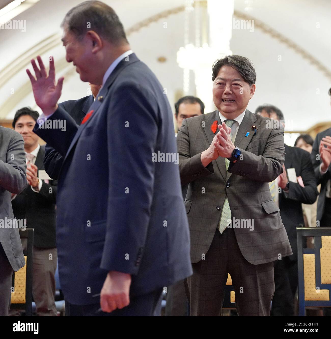 Japanese Prime Minister Shigeru Ishiba (L) and Chief Cabinet Secretary Yoshimasa Hayashi attend ...