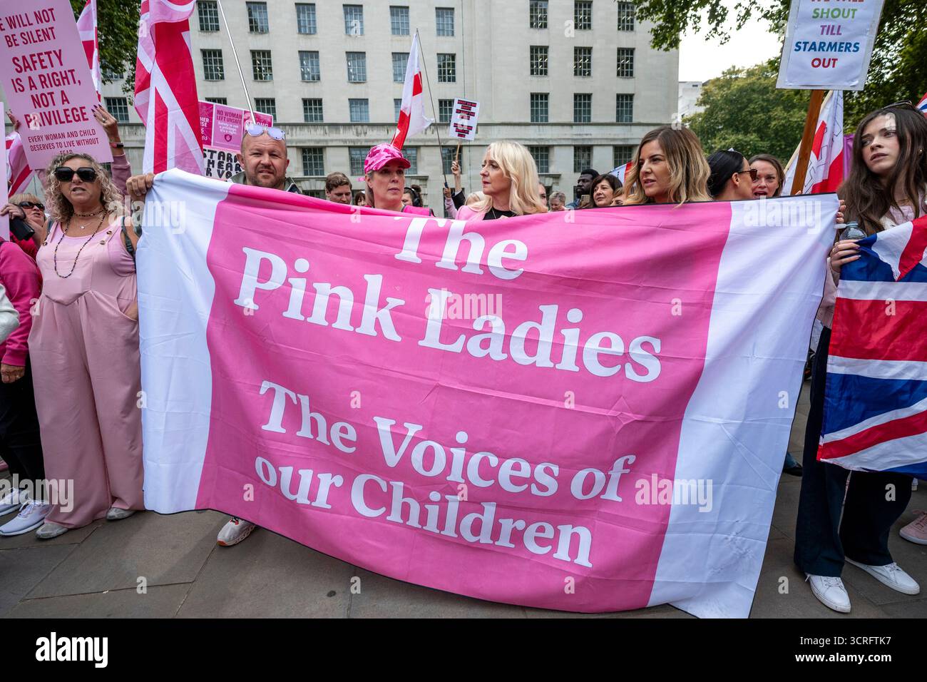 London, UK. 1 October 2025. People take part in a ‘pink protest’ in ...