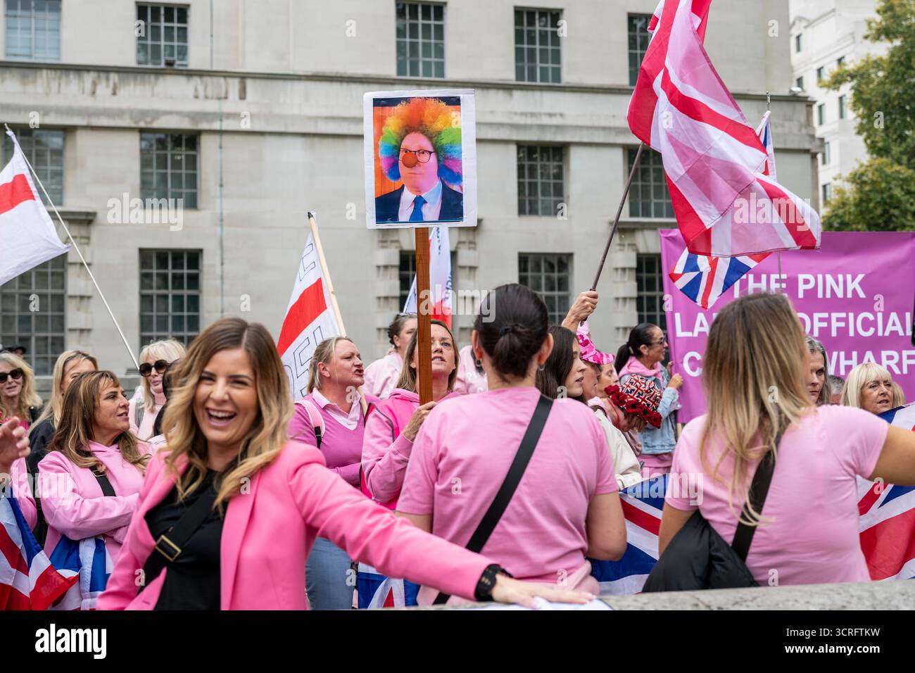 London, UK. 1 October 2025. People take part in a ‘pink protest’ in ...