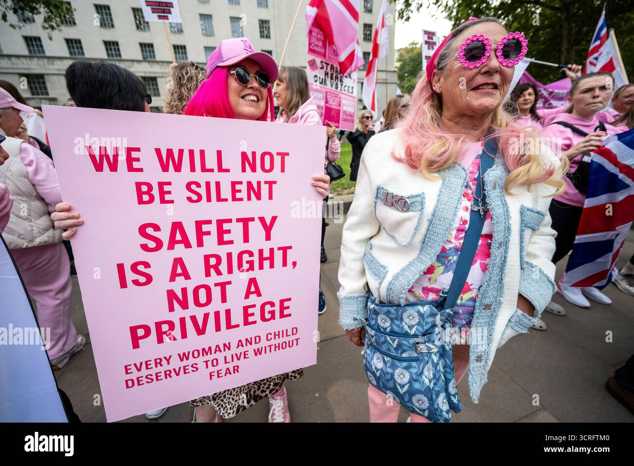 London, UK. 1 October 2025. People take part in a ‘pink protest’ in ...