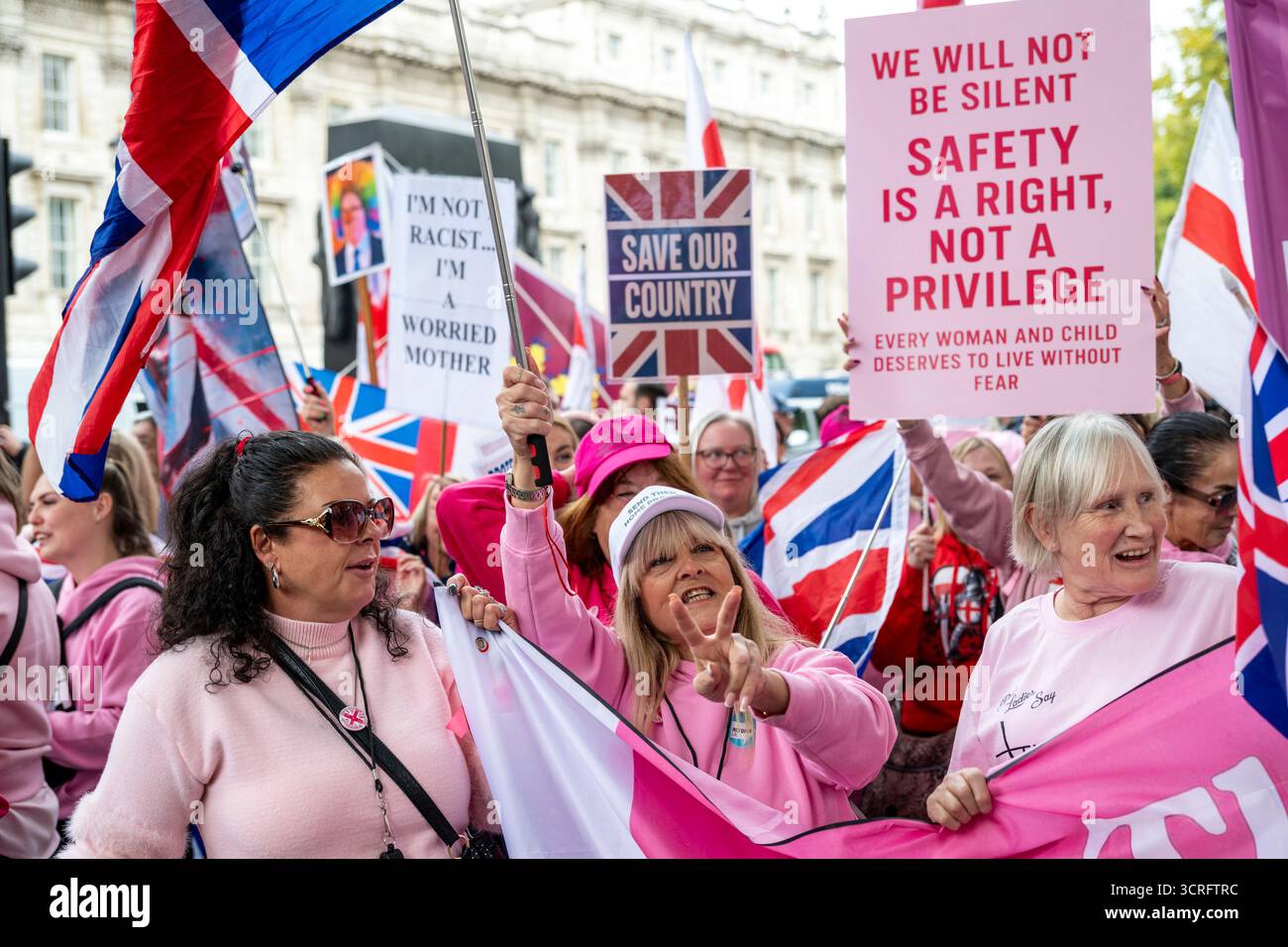 London, UK. 1 October 2025. People take part in a ‘pink protest’ in ...