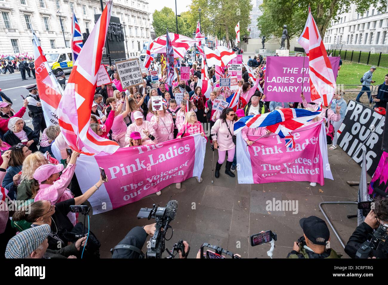 London, UK. 1 October 2025. People take part in a ‘pink protest’ in ...