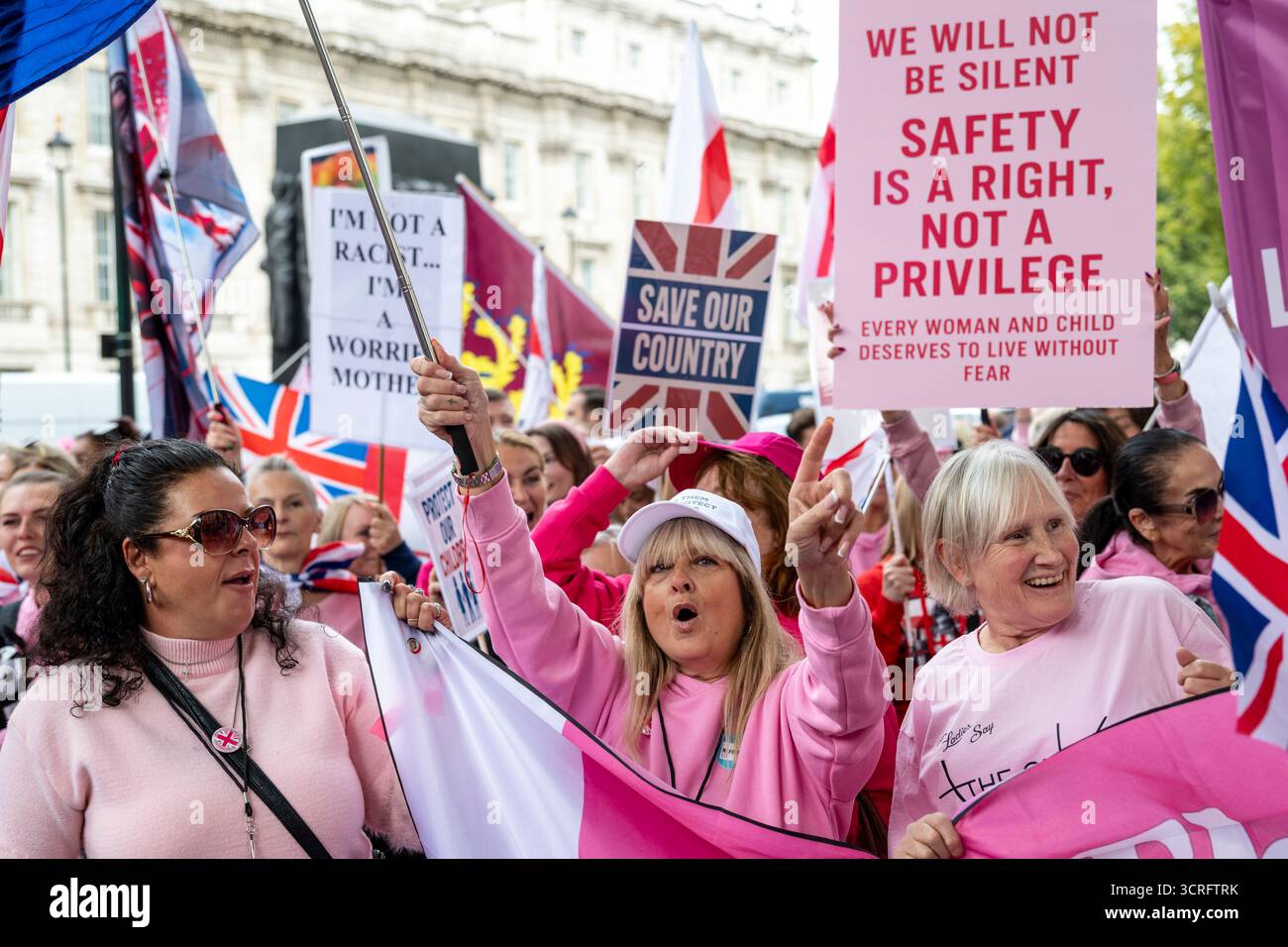London, UK. 1 October 2025. People take part in a ‘pink protest’ in ...