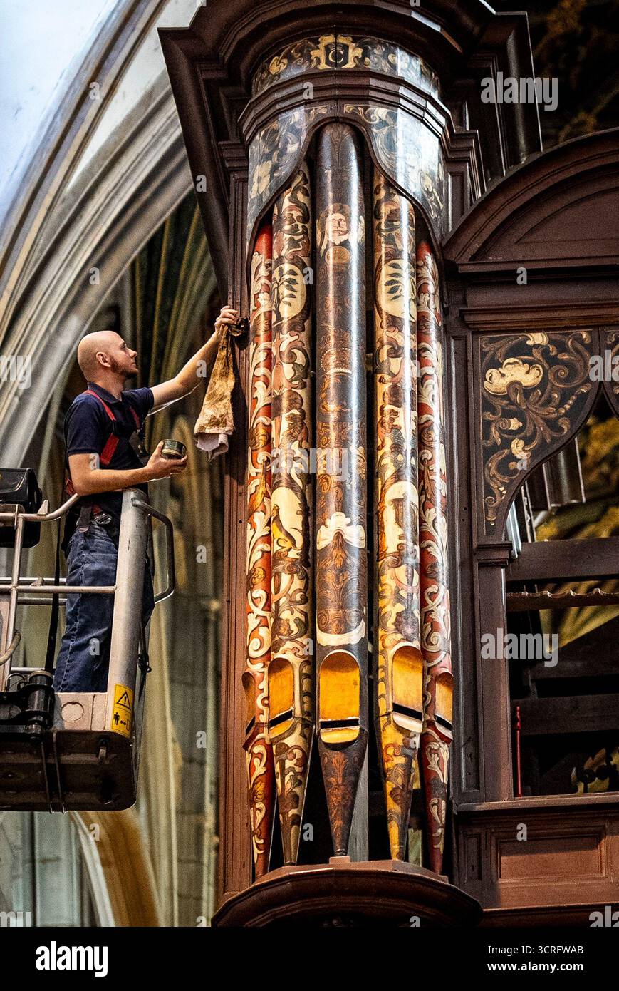 Specialist organ Builder Ed Reade, from Nicholson and Co Ltd, cleans ...