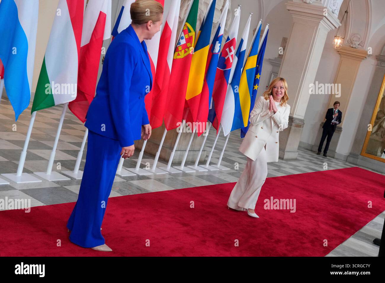 Denmark's Prime Minister Mette Frederiksen, left, welcomes Italian ...
