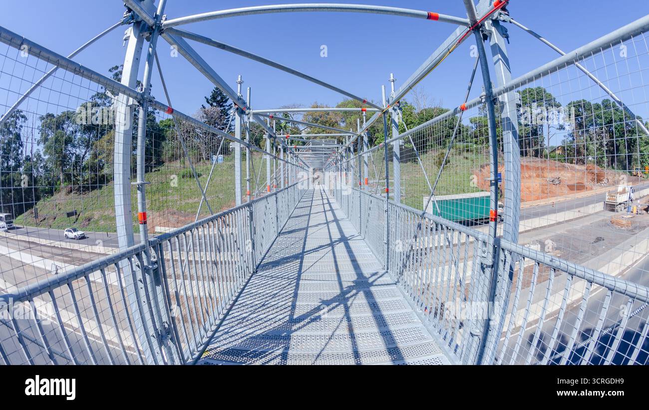 Steel scaffolding temporary pedestrian public bridge walkway crossing ...