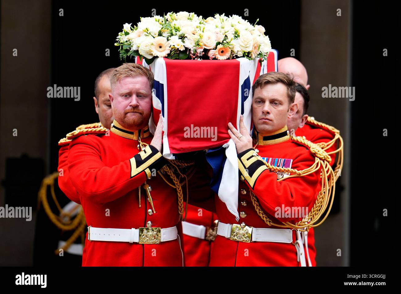The Bearer Party carry the coffin after the funeral for Captain ...