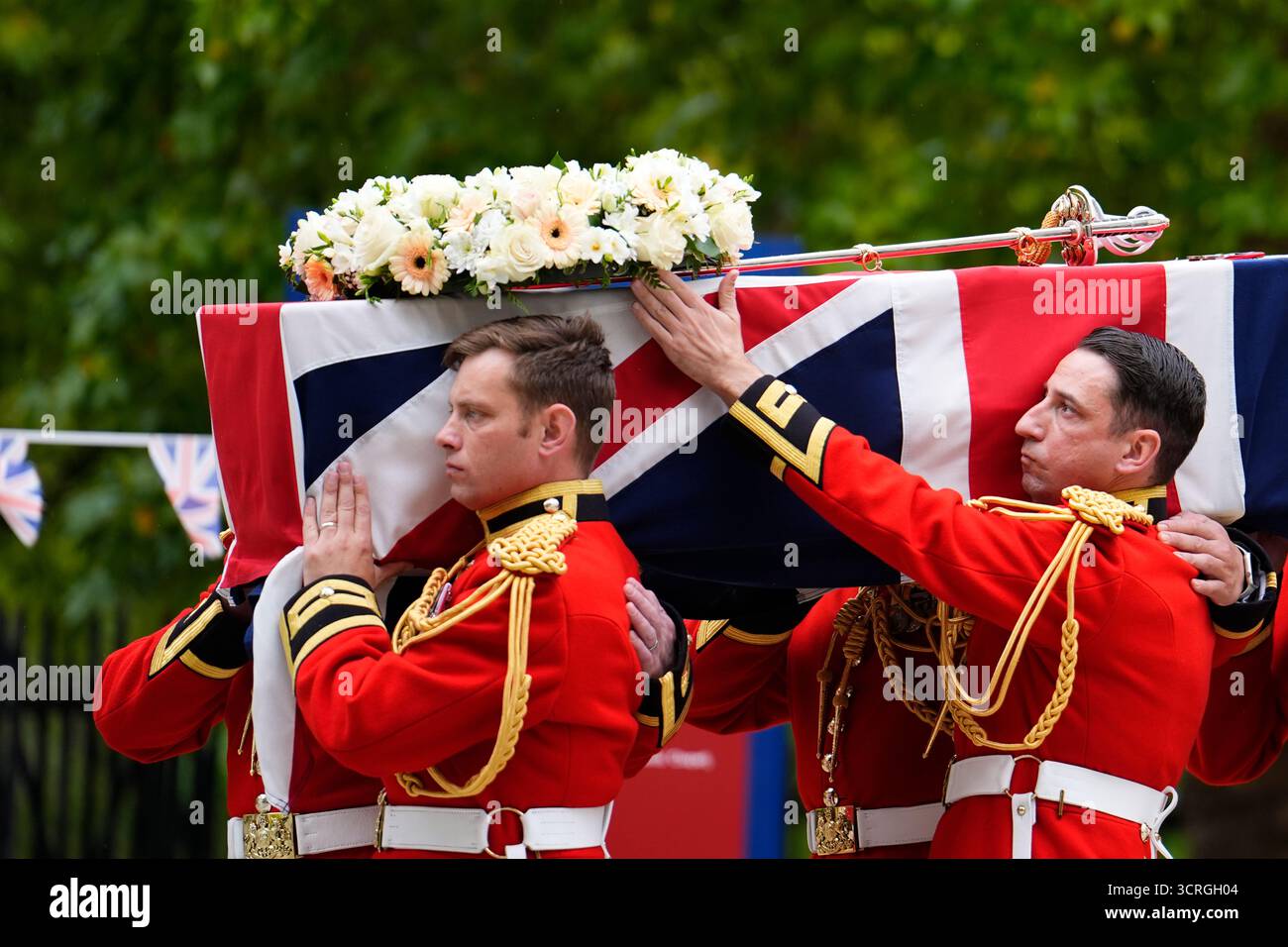 The Bearer Party carry the coffin after the funeral for Captain ...