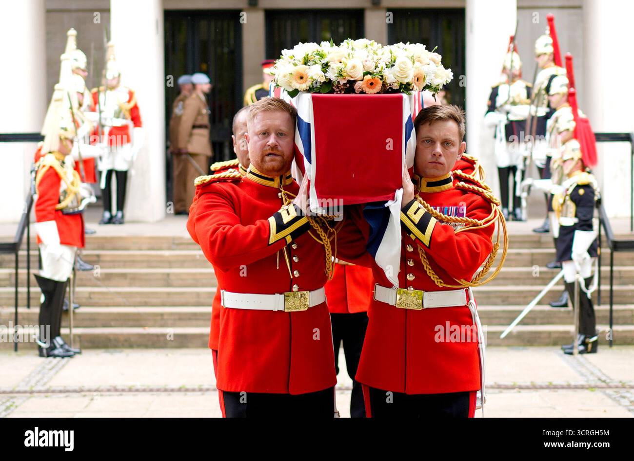 The Bearer Party carry the coffin after the funeral for Captain ...