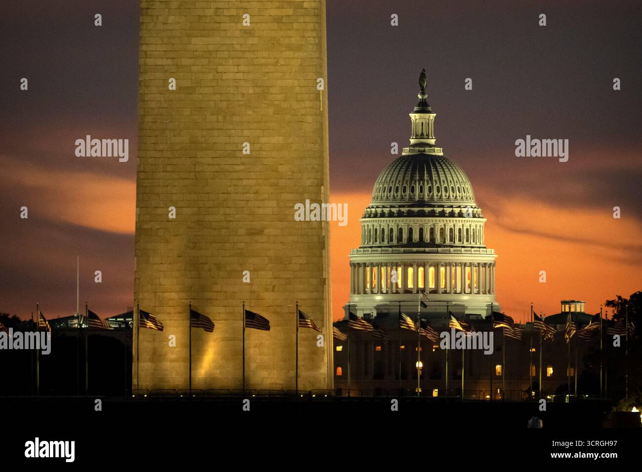 The base of the Washington Monument and the dome of the U.S. Capitol ...