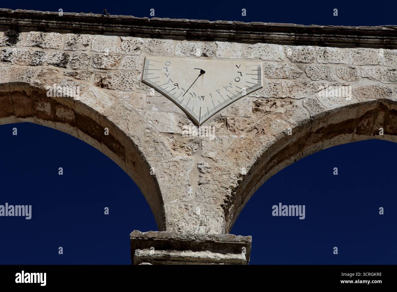 Sundial seen on one of the Arches of Scales, under is the Dome of the ...