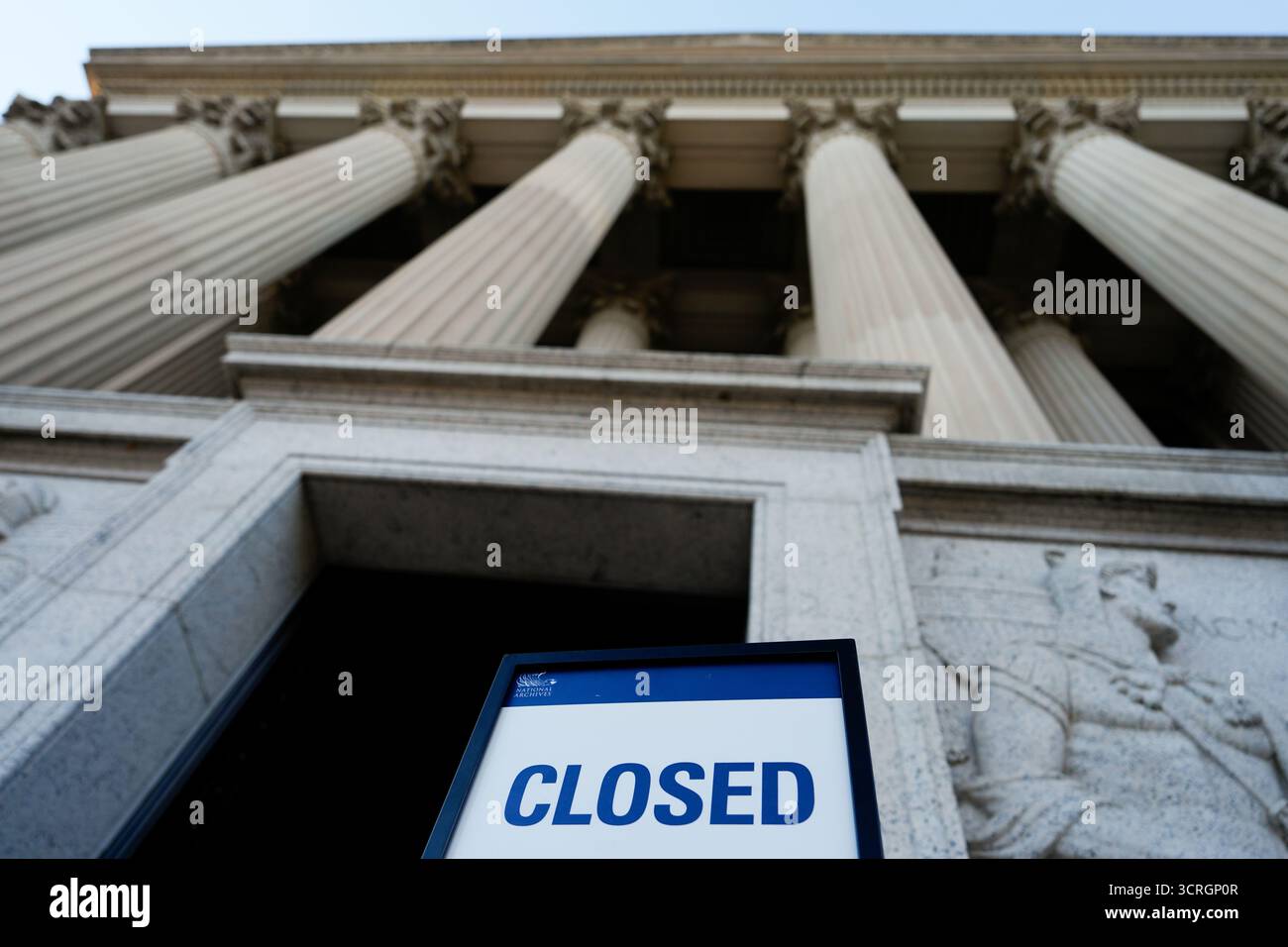 A closed sign stands in front of the National Archives on the first day ...