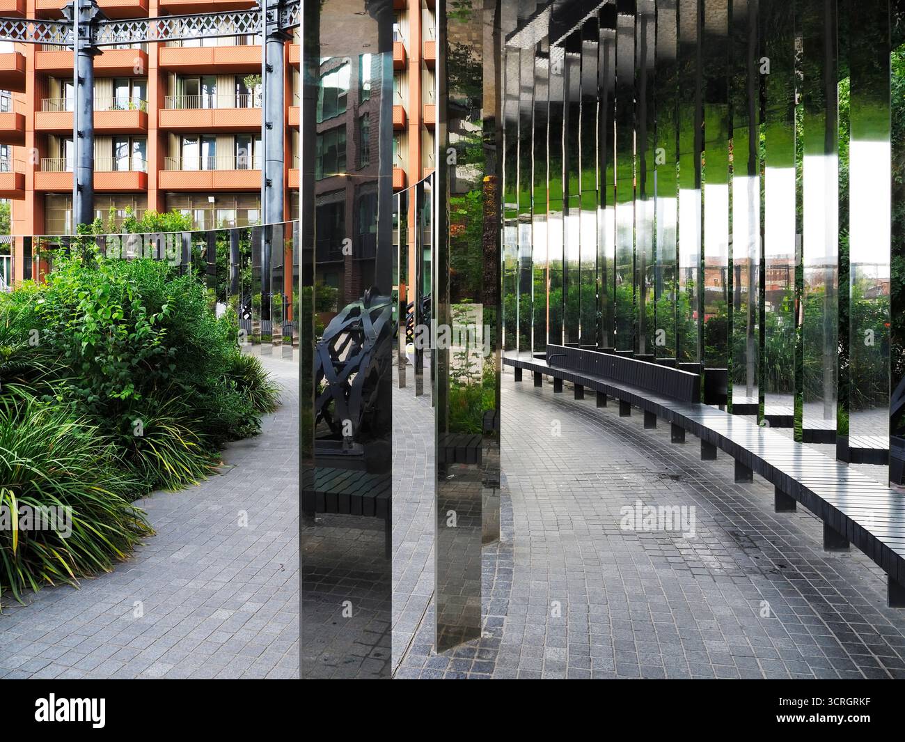 Modern garden with mirrored walkway in an old gasholder at Gasholder ...
