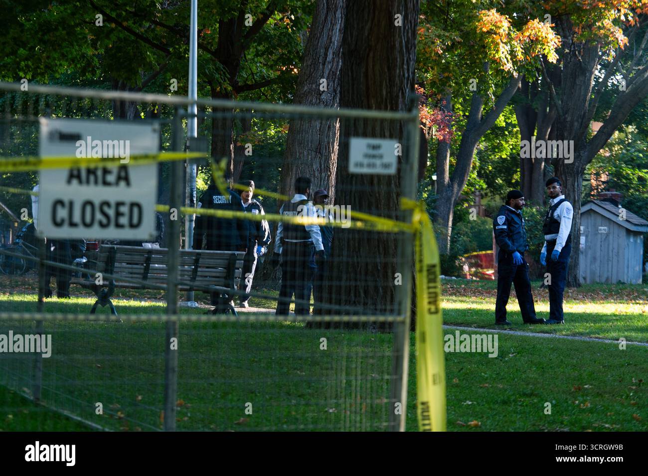 Security guards watch over Dufferin Grove Park in Toronto, on Wednesday ...