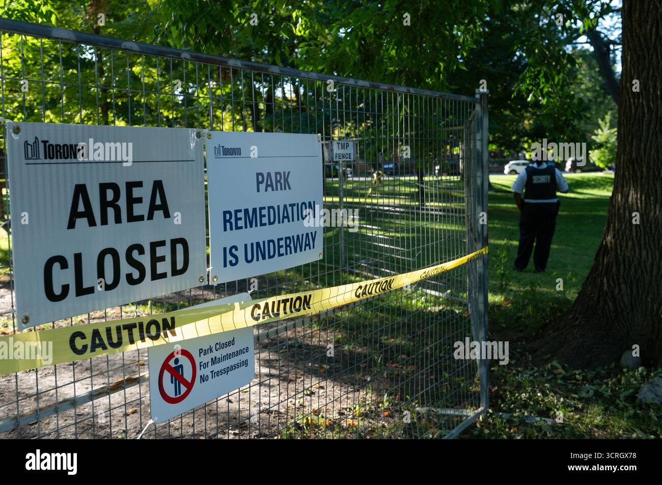 Security guards watch over Dufferin Grove Park in Toronto, on Wednesday ...