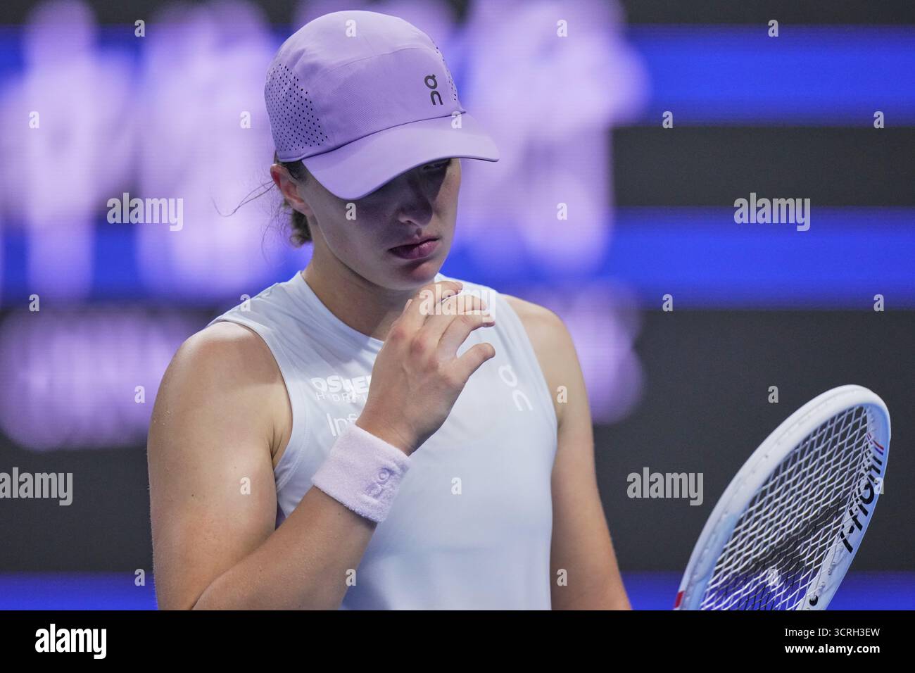 Iga Swiatek, of Poland reacts during the women's singles match against Emma Navarro, of the ...