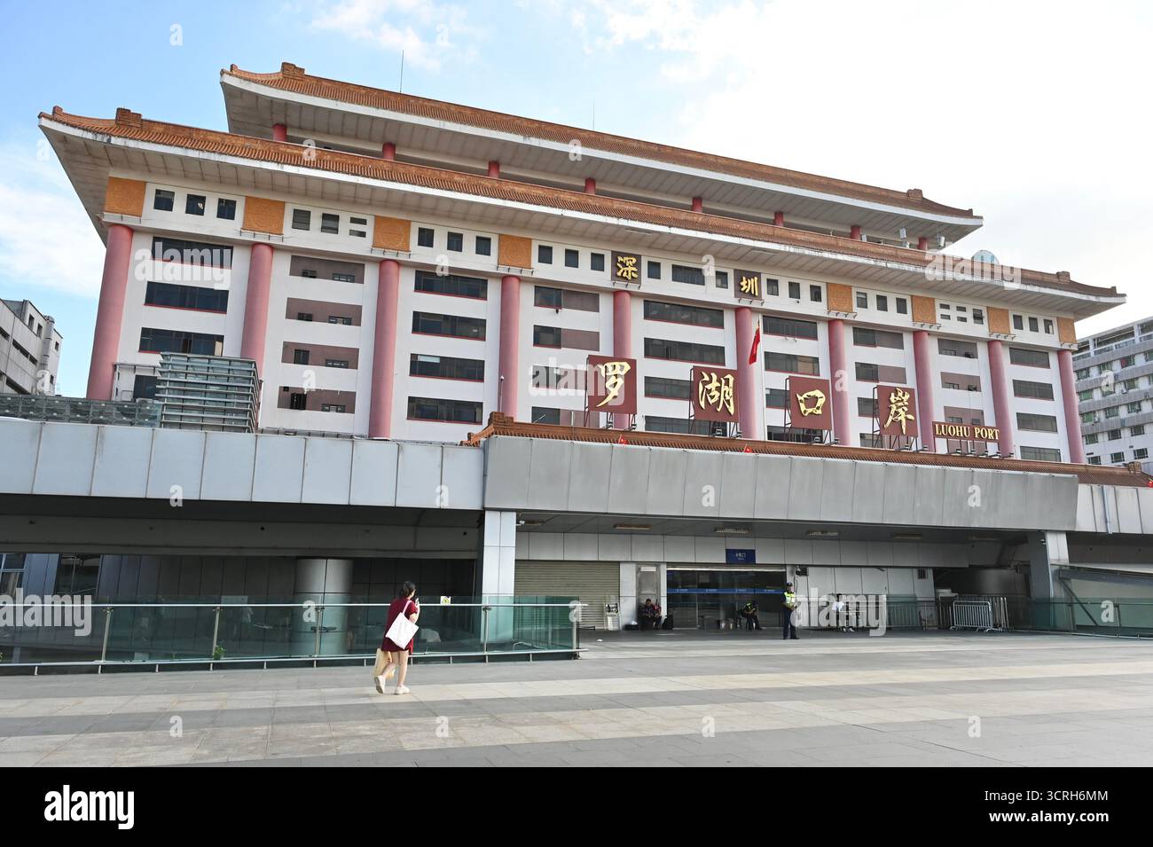 A lady walking pass the Luohu Port on October 1, 2025 in Shenzhen ...
