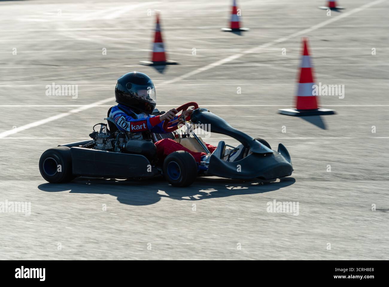 Go-kart is driven on race track in high speed Stock Photo - Alamy