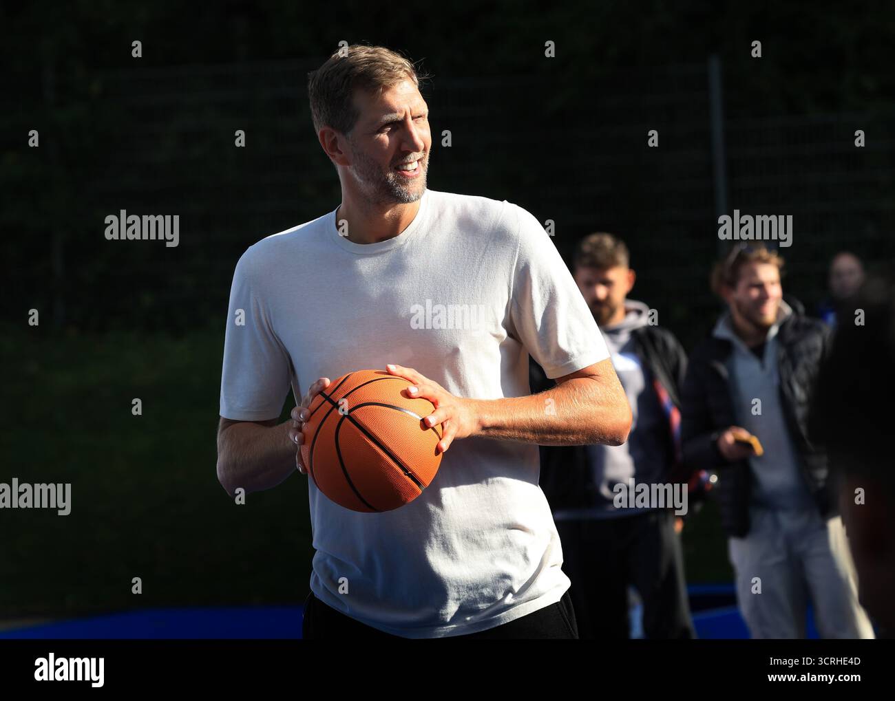 01 October 2025, Bavaria, Würzburg: Dirk Nowitzki holds a basketball at ...